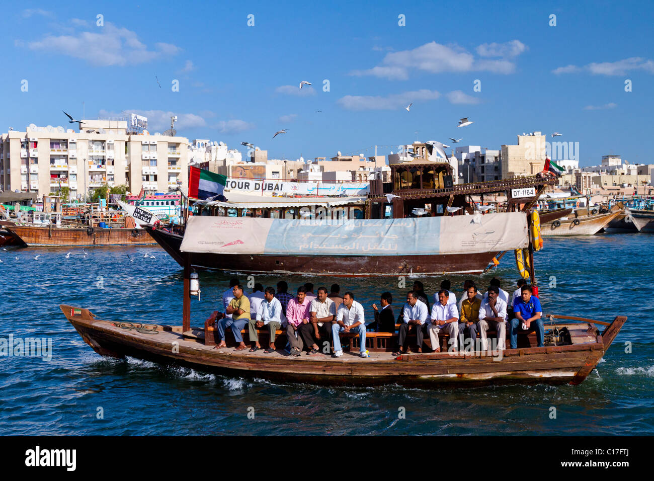 Small wooden Dow boats offer water taxi service across Dubai Creek in ...