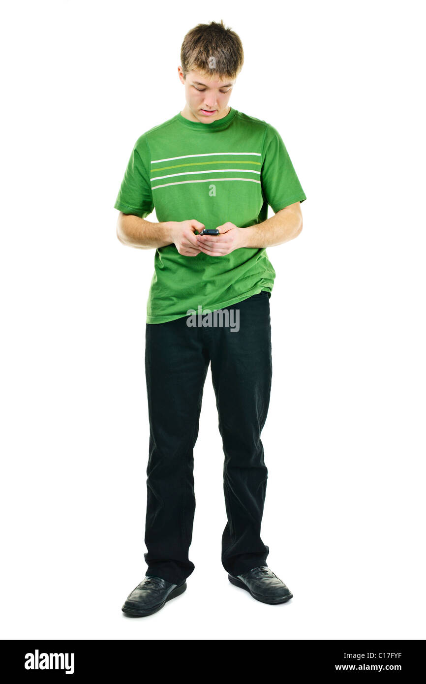 Young man texting on cellphone standing full body isolated on white ...