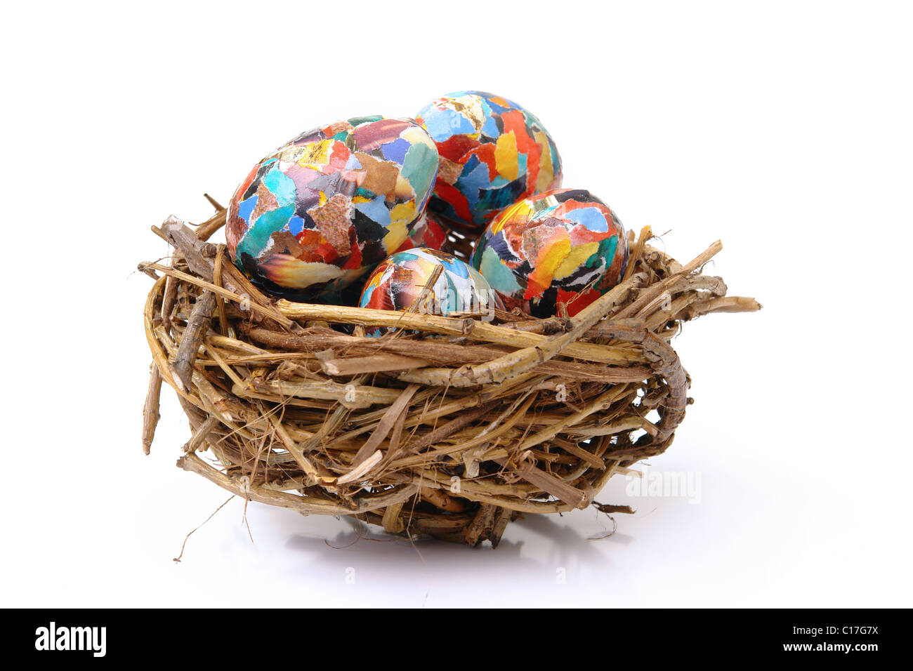Bunch of paper collage eggs in bird's nest over white background Stock ...