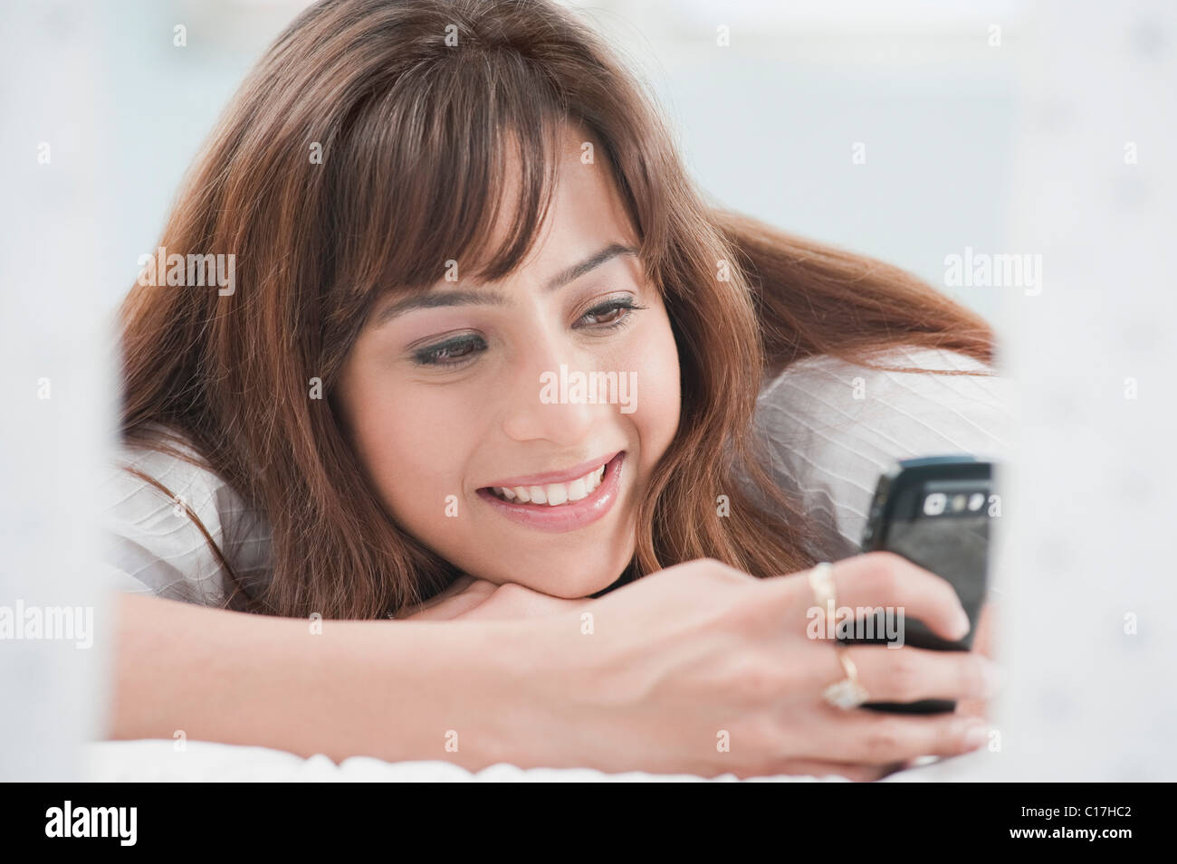 Woman text messaging on a mobile phone Stock Photo - Alamy