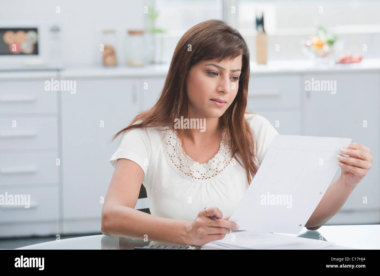 Woman sorting bills Stock Photo - Alamy