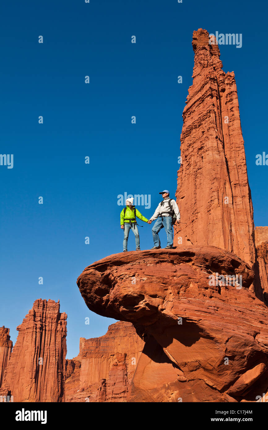 Team of hikers reach the summit of a sandstone pinnacle Stock Photo - Alamy