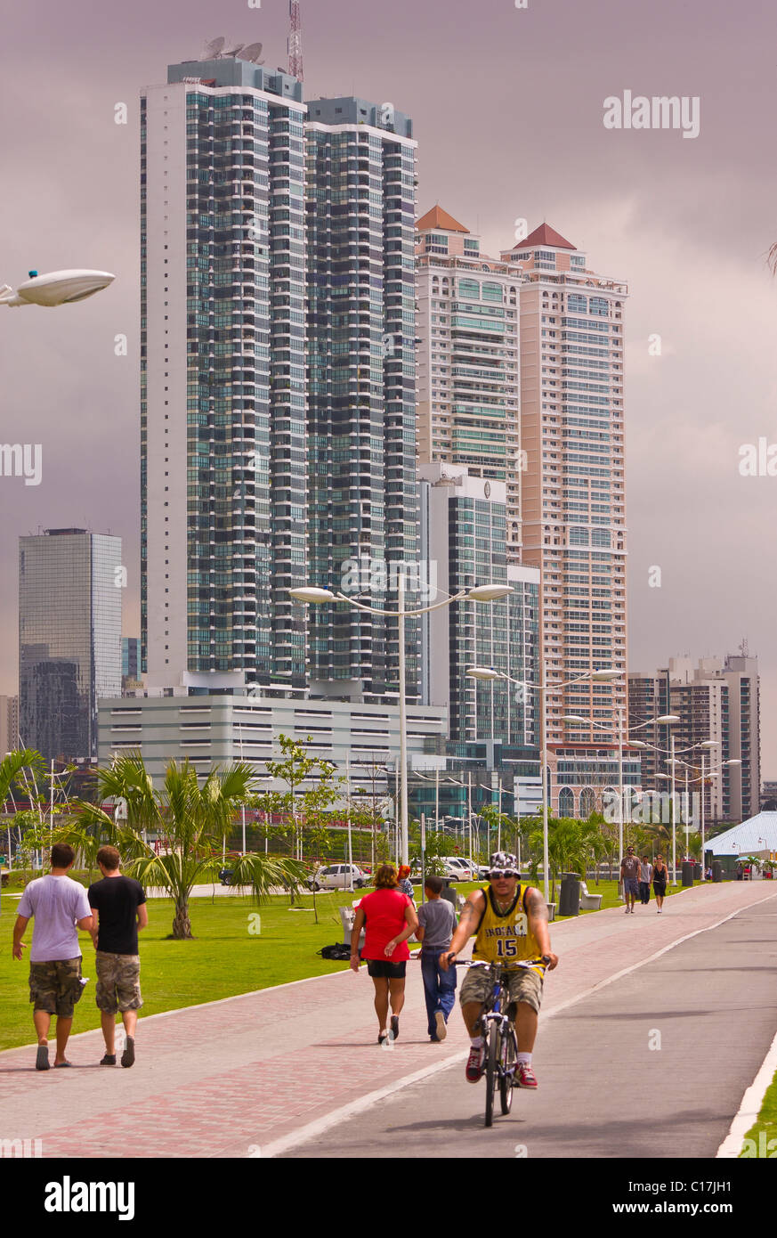 PANAMA CITY, PANAMA - People on pedestrian path, and skyscrapers on ...