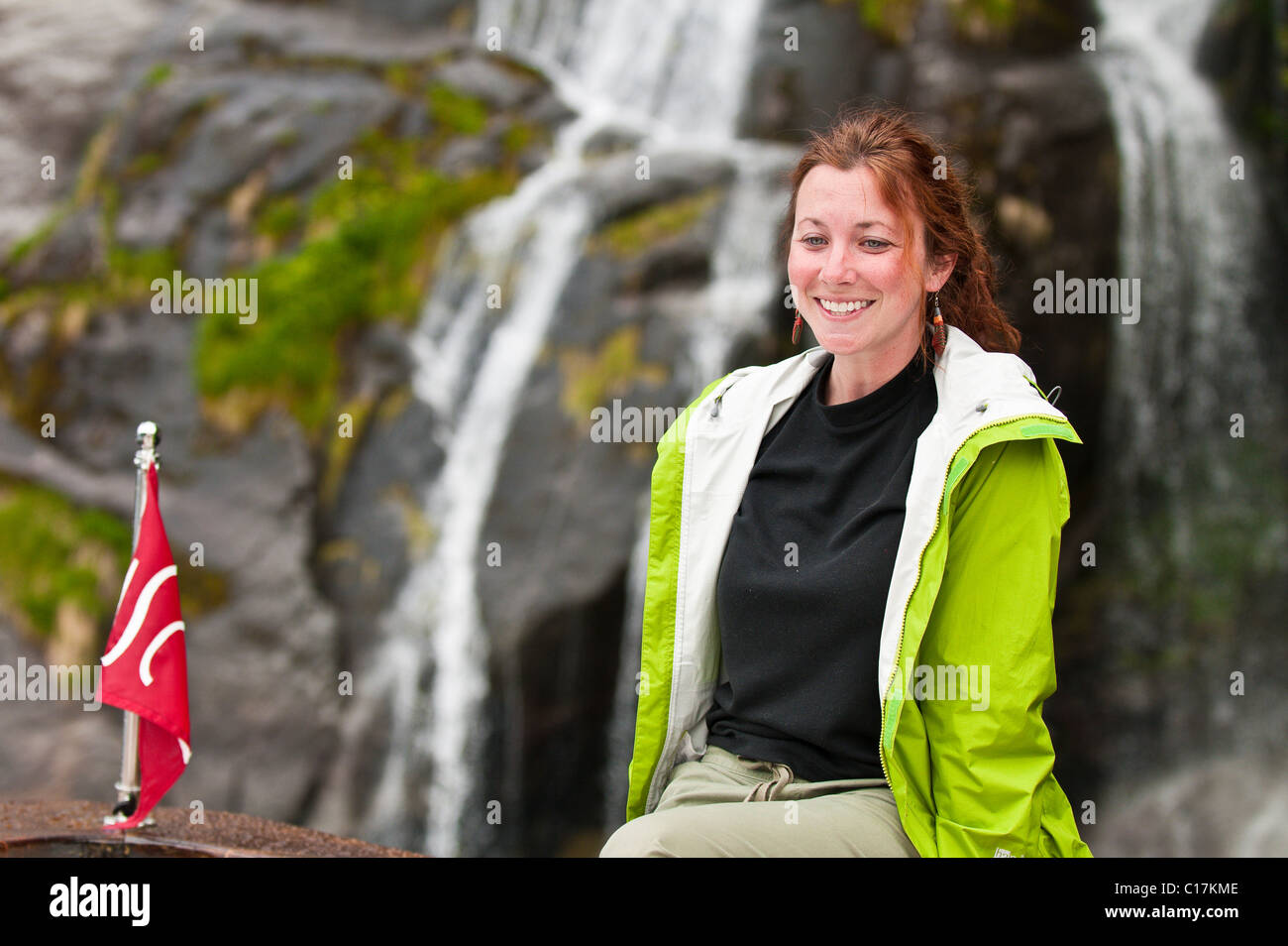 Alaska. Young woman on boat in Walker Cove area of Misty Fjords ...