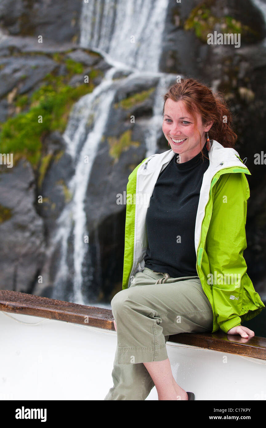 Alaska. Woman on boat in Walker Cove area of Misty Fjords National ...