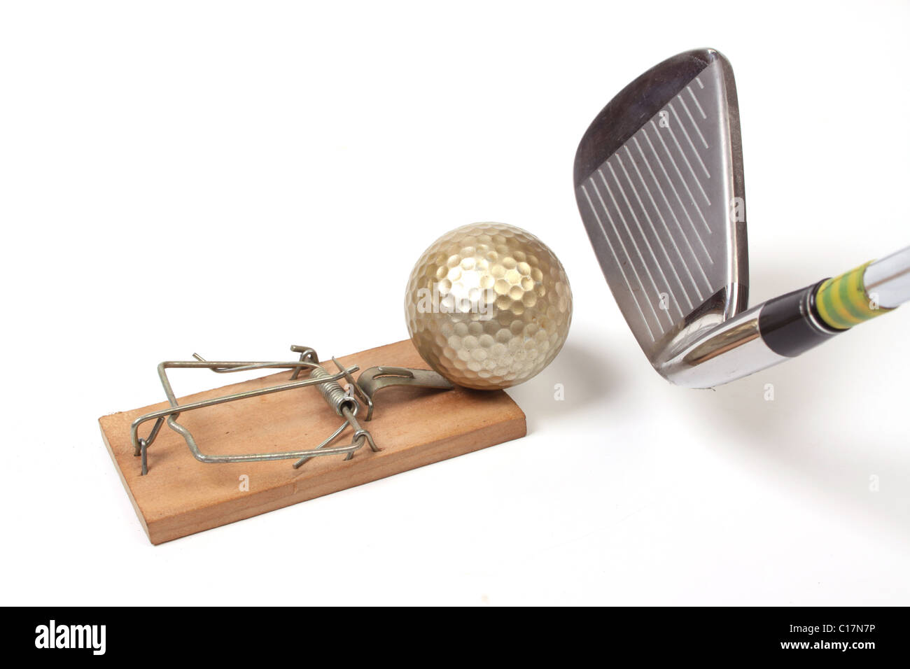 Golf ball in a mousetrap Stock Photo - Alamy