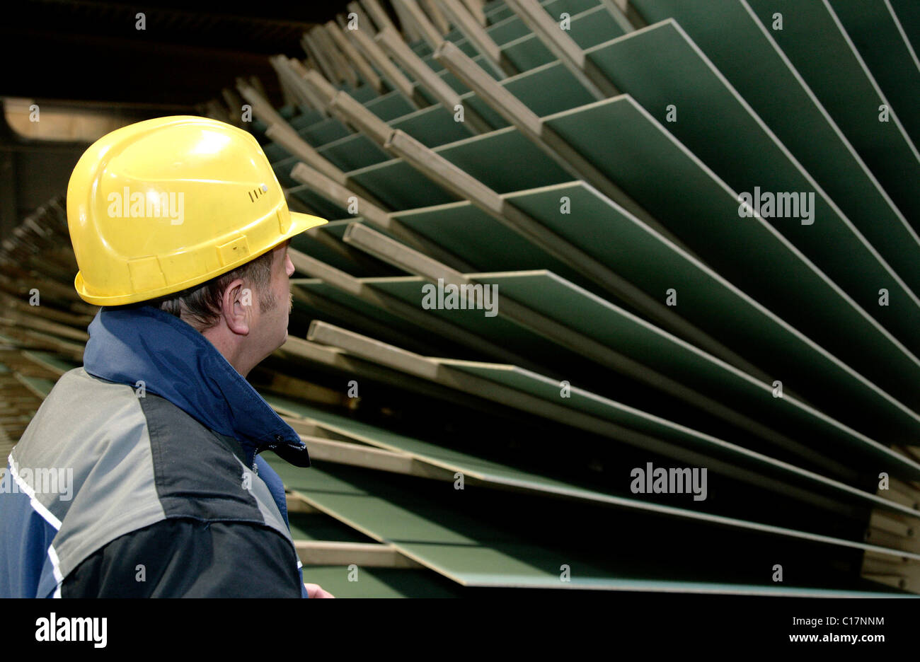 An employee of the Pfleiderer AG controlling the cooling turner in the ...