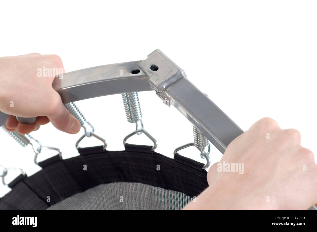 Hands assembling foldable trampoline Stock Photo - Alamy