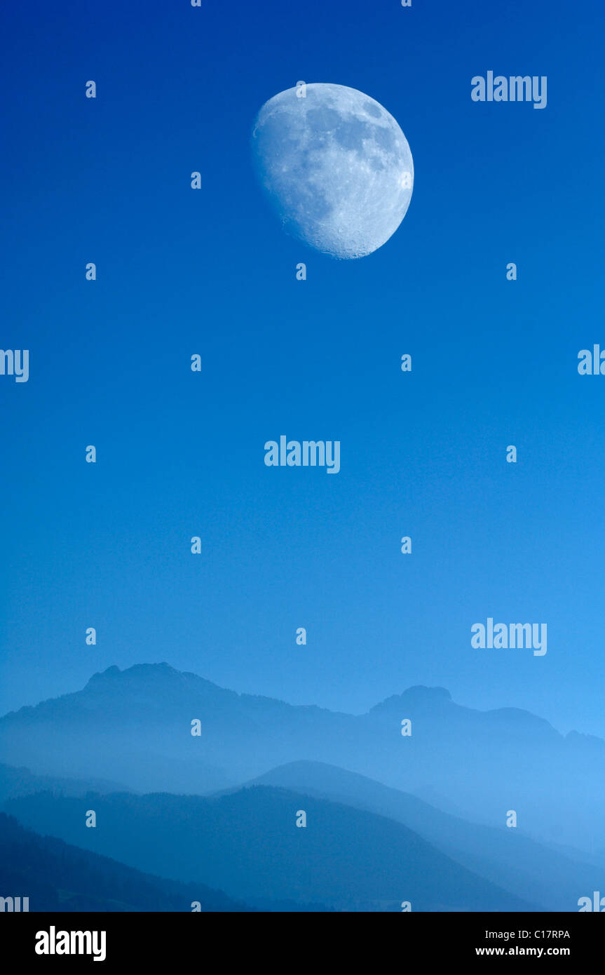 Mountains with moon Stock Photo - Alamy
