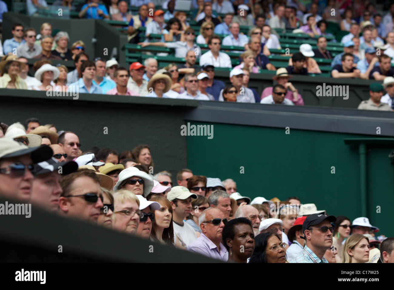 Spectators watch the tennis at the All England Lawn Tennis ...