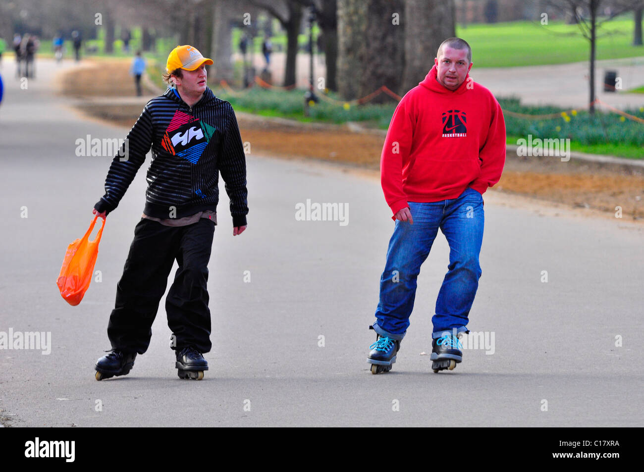 two men roller blading in Hyde Park Stock Photo - Alamy