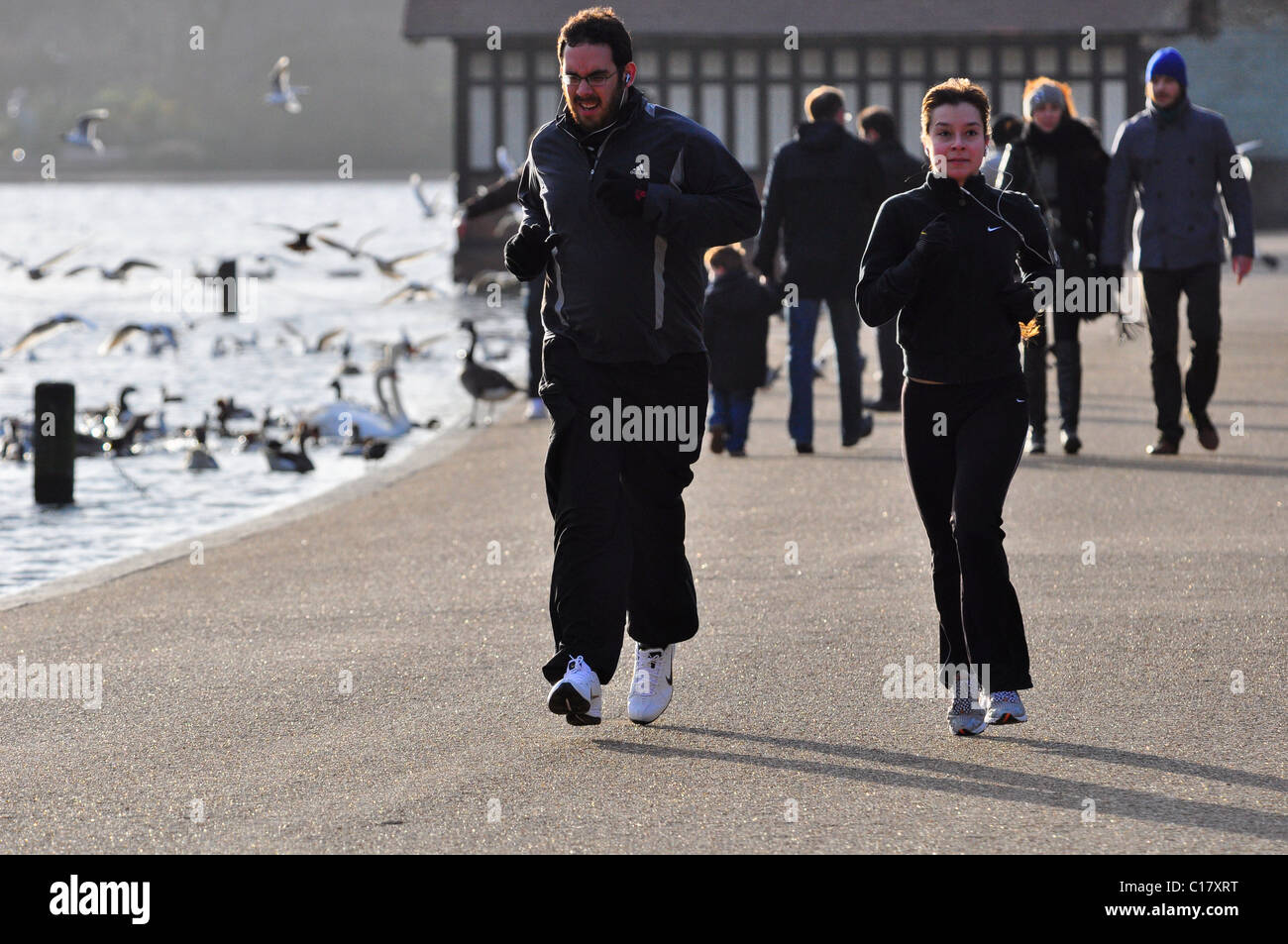 Large man jogging with his personal trainer in Hyde Park Stock Photo ...