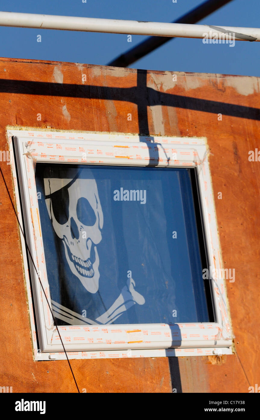 A canal boat window with pirate skull & bones Stock Photo - Alamy
