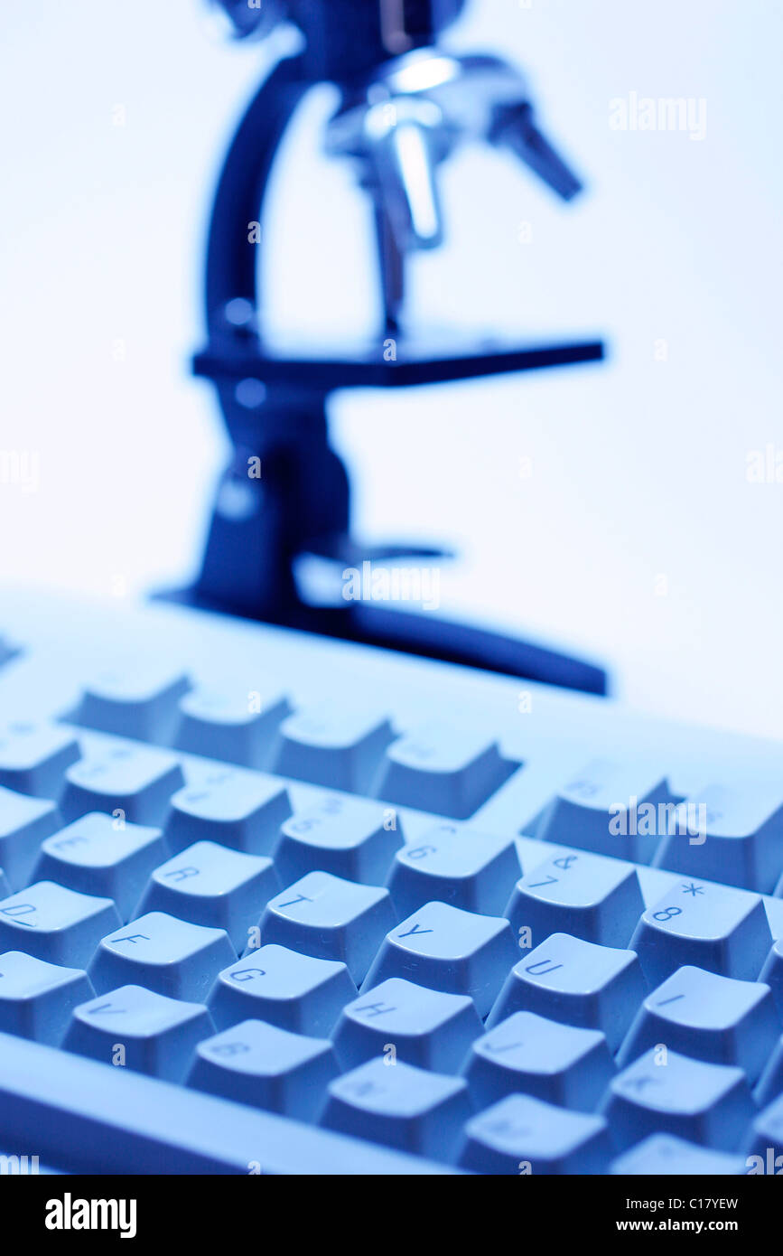 Microscope and computer keyboard Stock Photo - Alamy