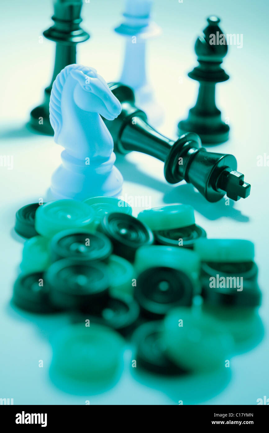 Chess and checkers, draughts pieces Stock Photo - Alamy