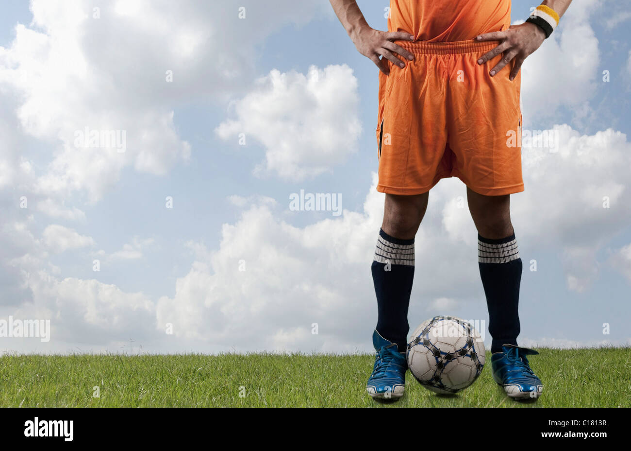 Soccer player standing in the soccer field Stock Photo - Alamy