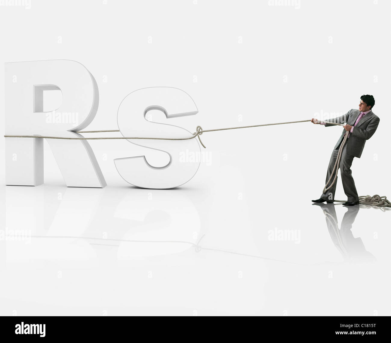 Businessman pulling Indian currency symbol Stock Photo - Alamy