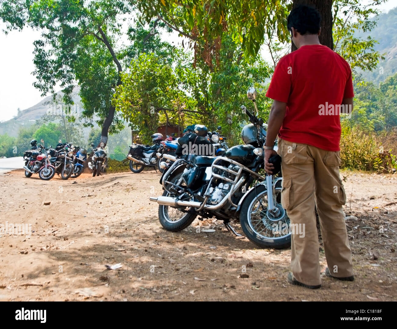 bikes parked at a watering stop, rider making phone call Stock Photo ...
