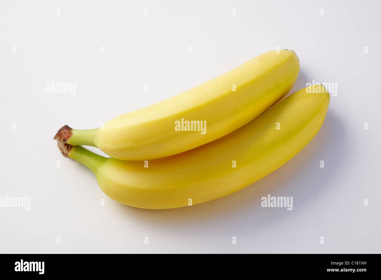 Pair of bananas isolated on white Stock Photo - Alamy