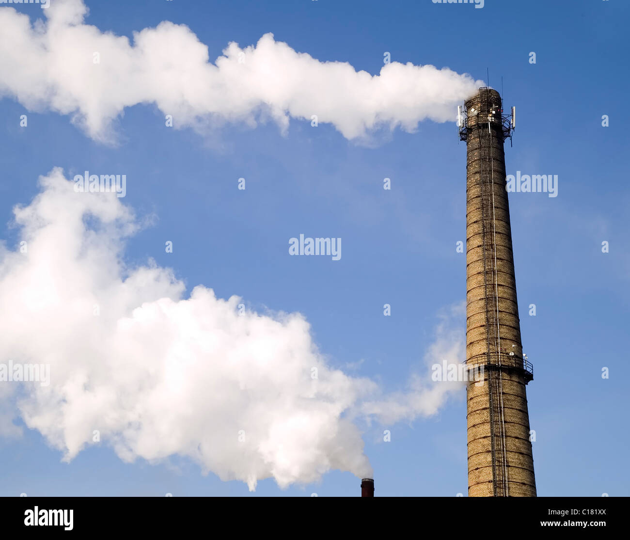 Chimney of factory with smoke on sky background Stock Photo - Alamy