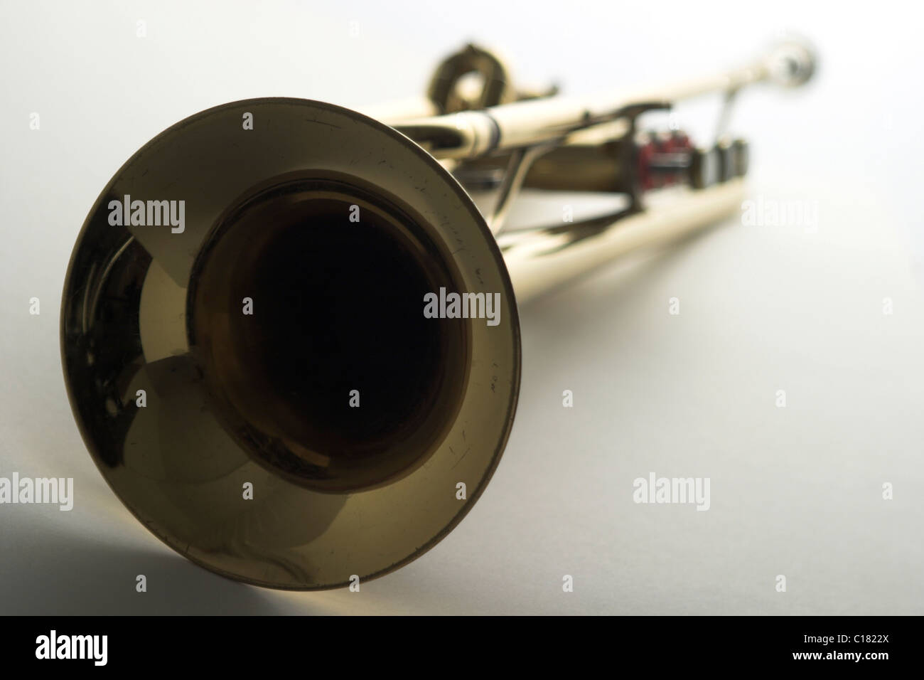 closeup of trumpet bell with focus on bell; brass lacquered trumpet ...