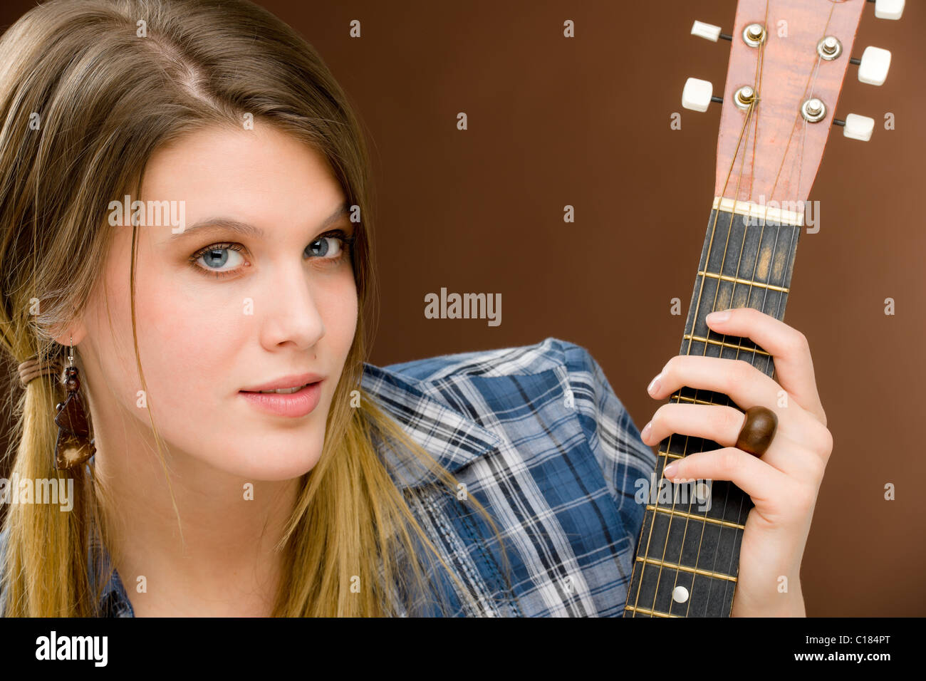 Rock musician - young fashion female model posing with guitar Stock ...