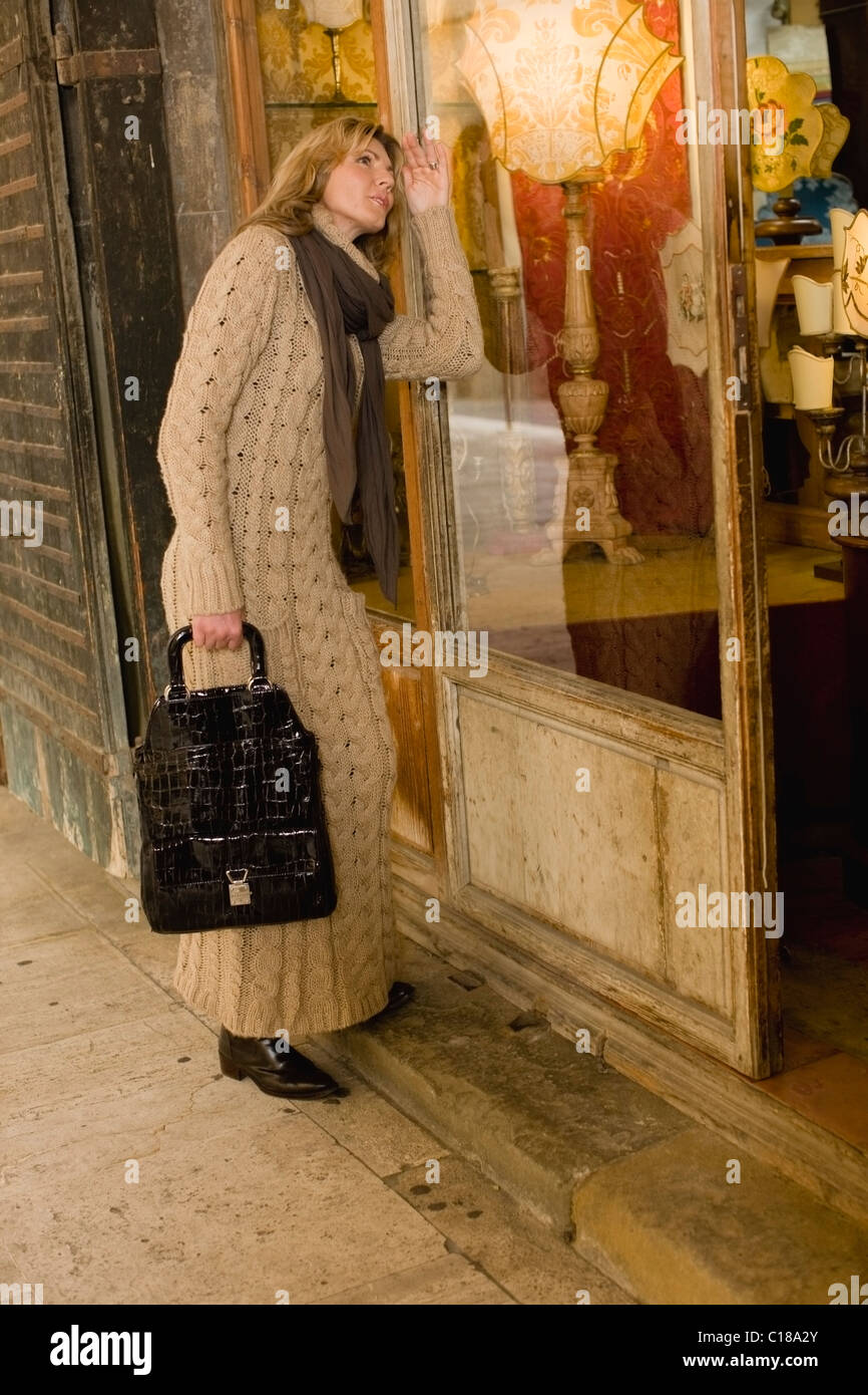 Peering into shop window hi-res stock photography and images - Alamy
