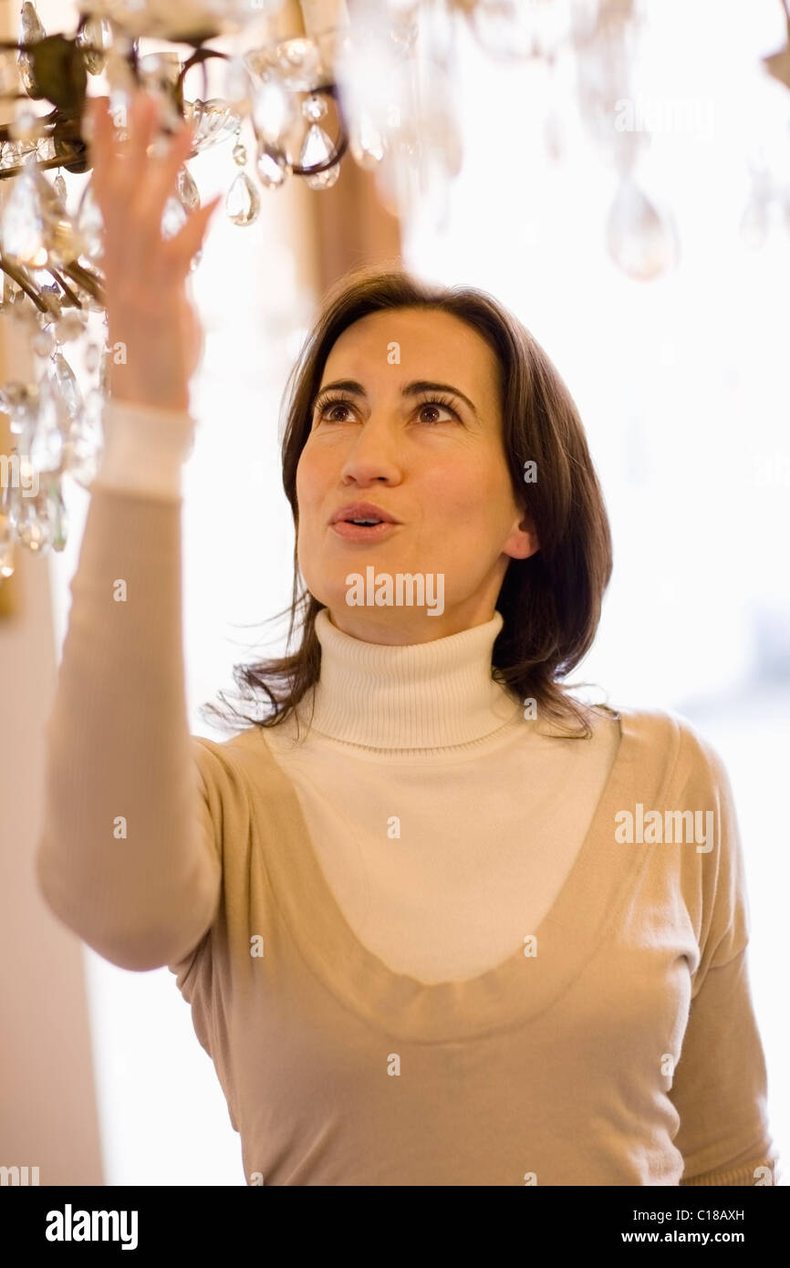 Woman marveling at candelabrum Stock Photo - Alamy