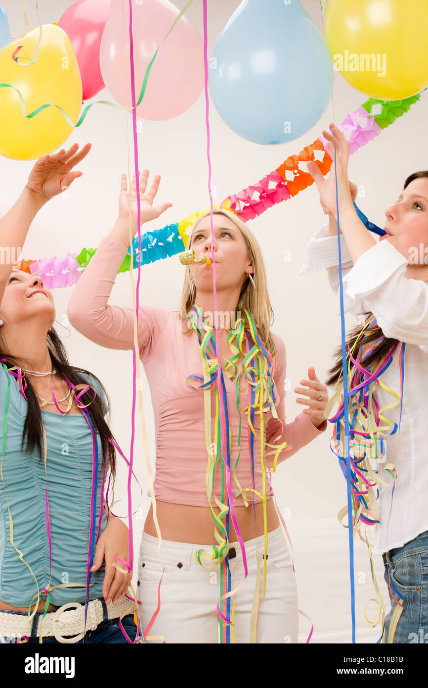 Birthday party celebration - four woman with confetti have fun, toast ...