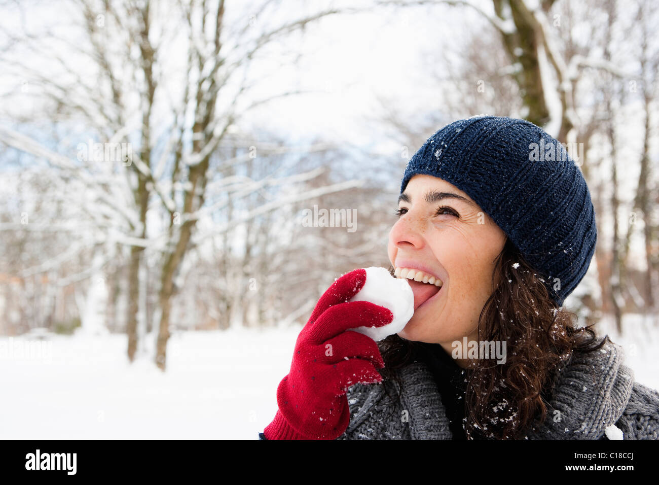 Woman eating snowball Stock Photo - Alamy