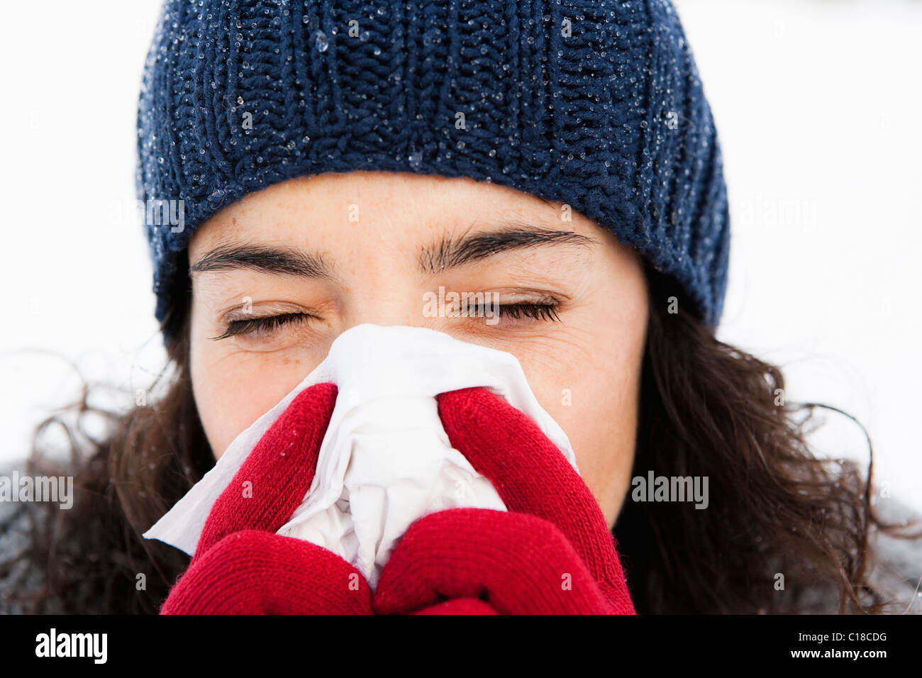 Woman wiping nose close-up Stock Photo - Alamy
