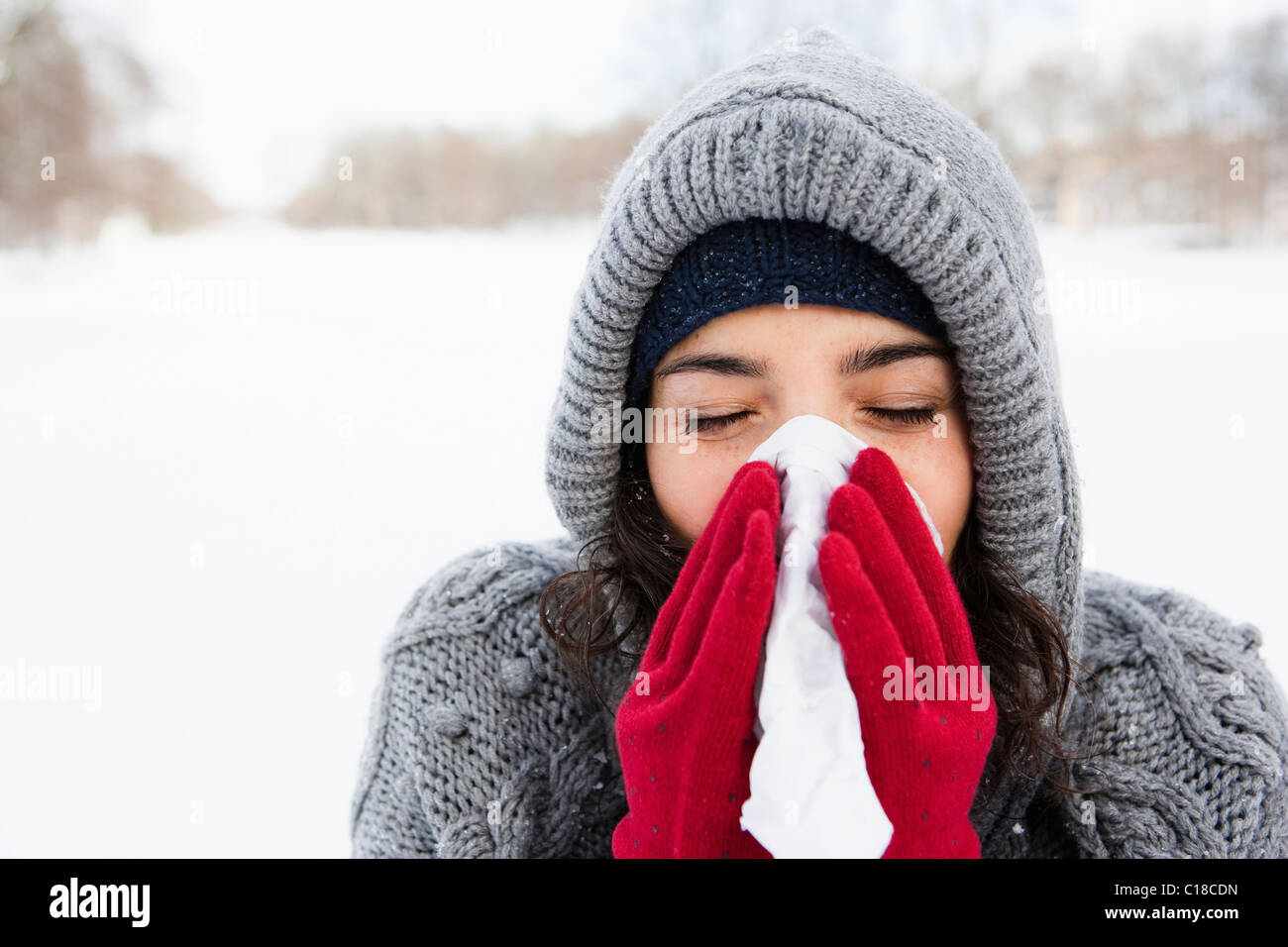 Woman using tissue Stock Photo - Alamy