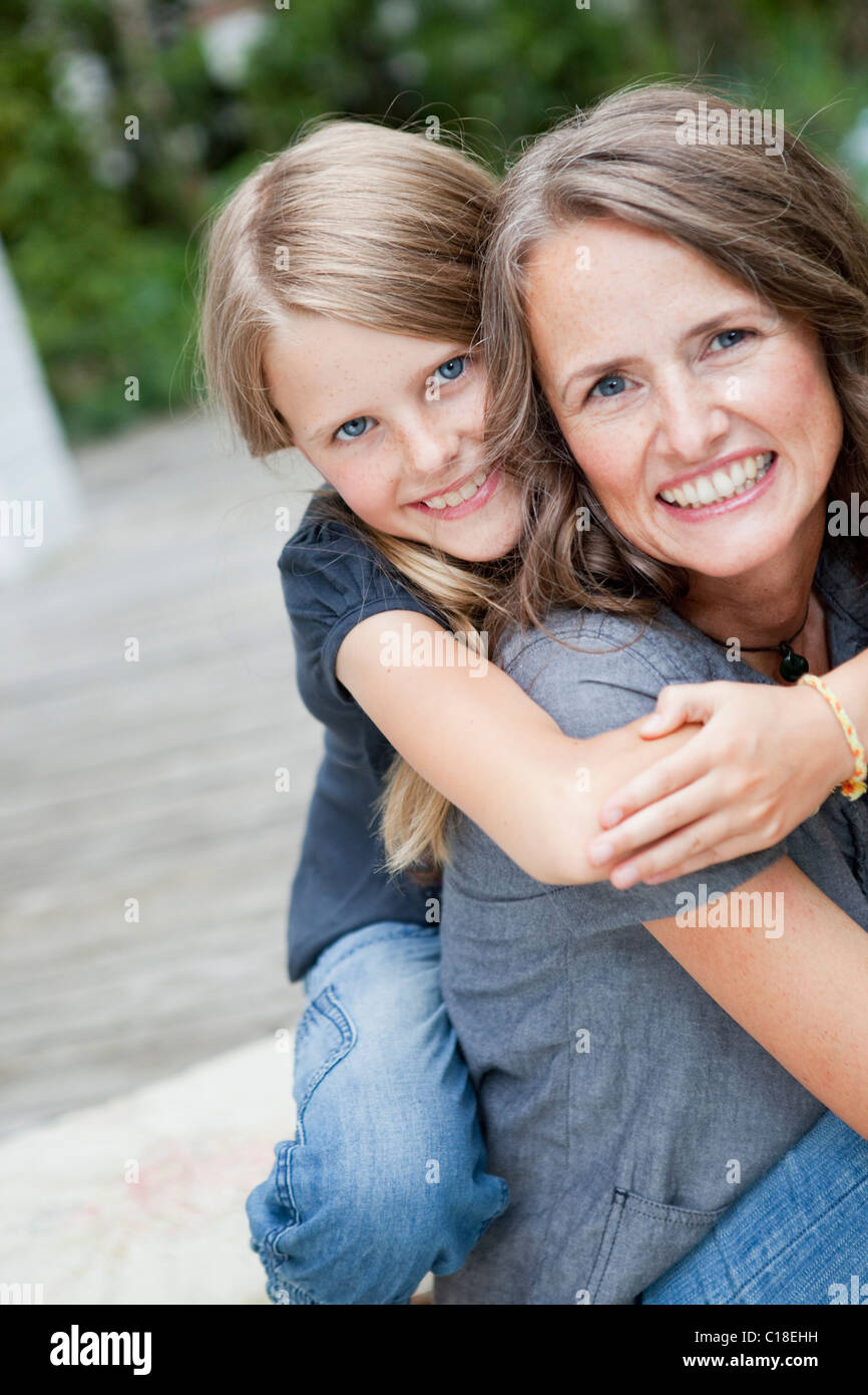 Crouching mother hugging her child hi-res stock photography and images ...