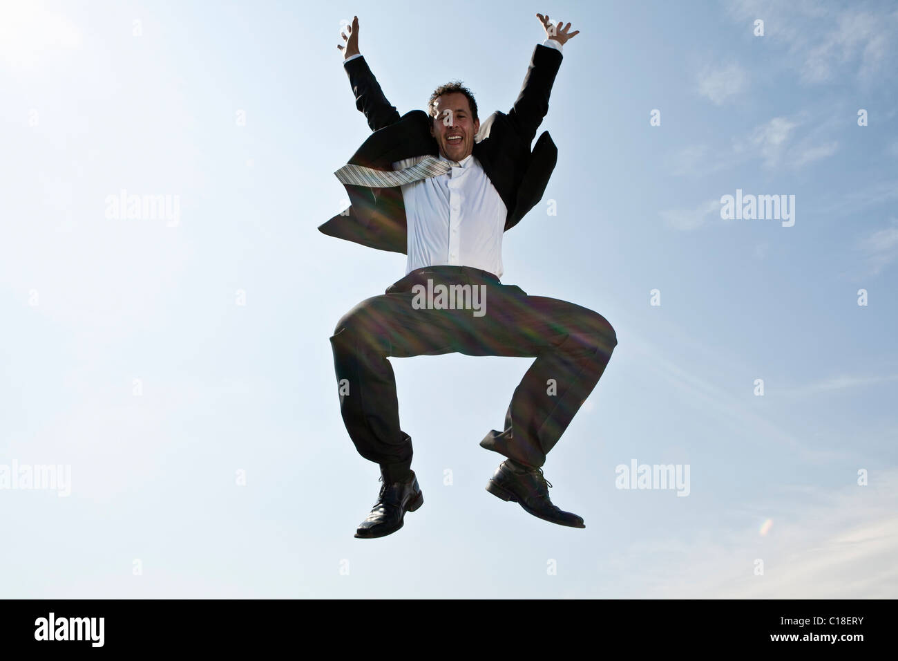 Business man jumping Stock Photo - Alamy