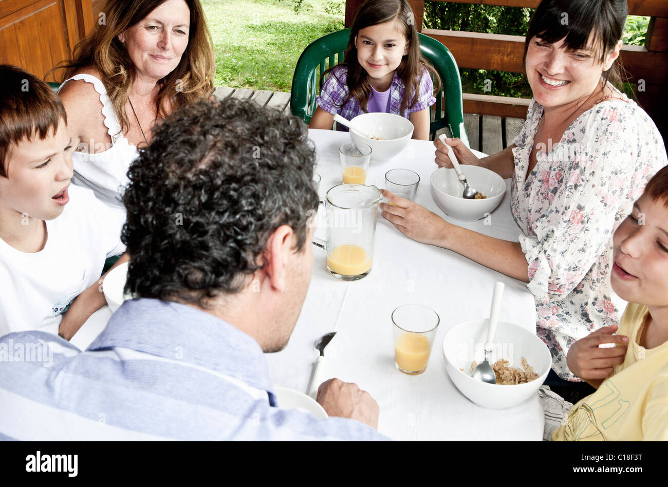 Smiling granddaughter enjoying breakfast hi-res stock photography and ...