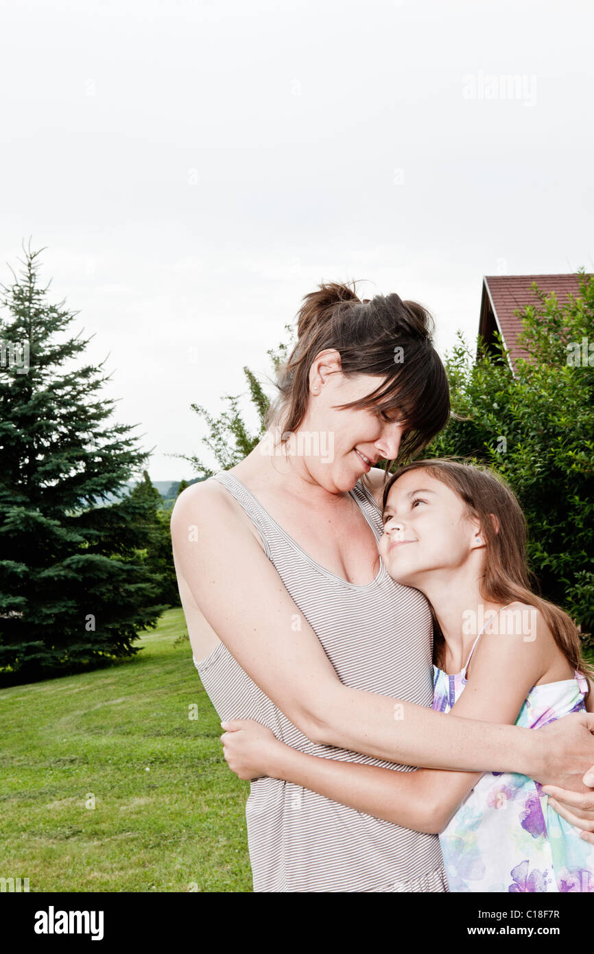 Mother and daughter hug Stock Photo - Alamy