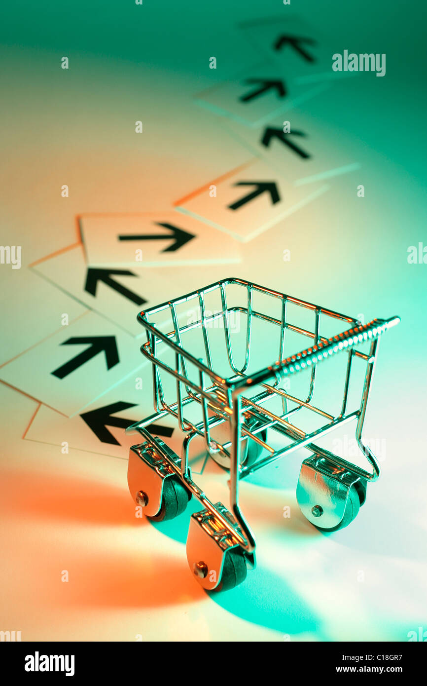 Shopping trolley and arrow signs Stock Photo - Alamy