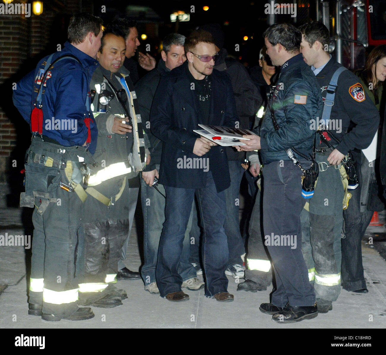 Bono of U2 signs autographs for NYC Firemen of Engine 65 as they arrive ...