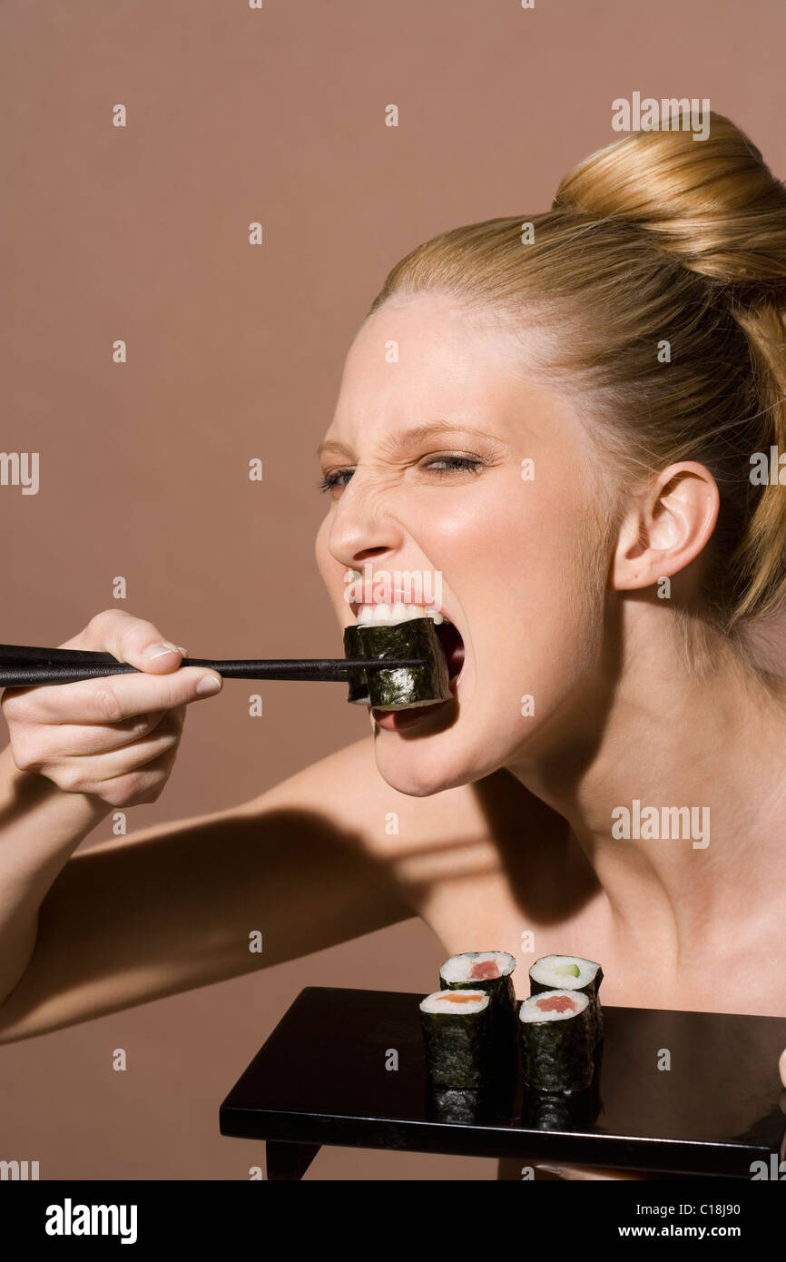 People eating sushi hi-res stock photography and images - Alamy