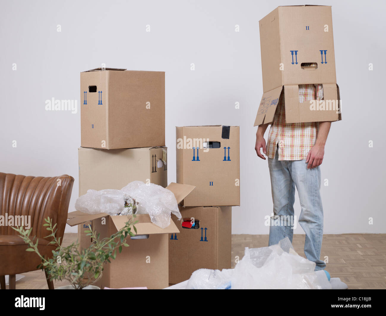 Young women with boxes unpacking Stock Photo - Alamy