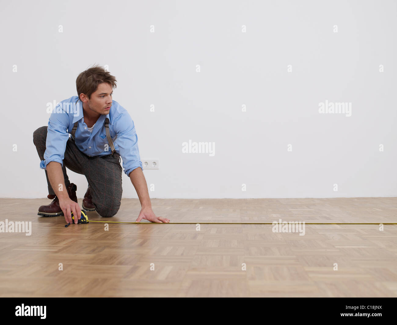 Man is measuring Stock Photo - Alamy