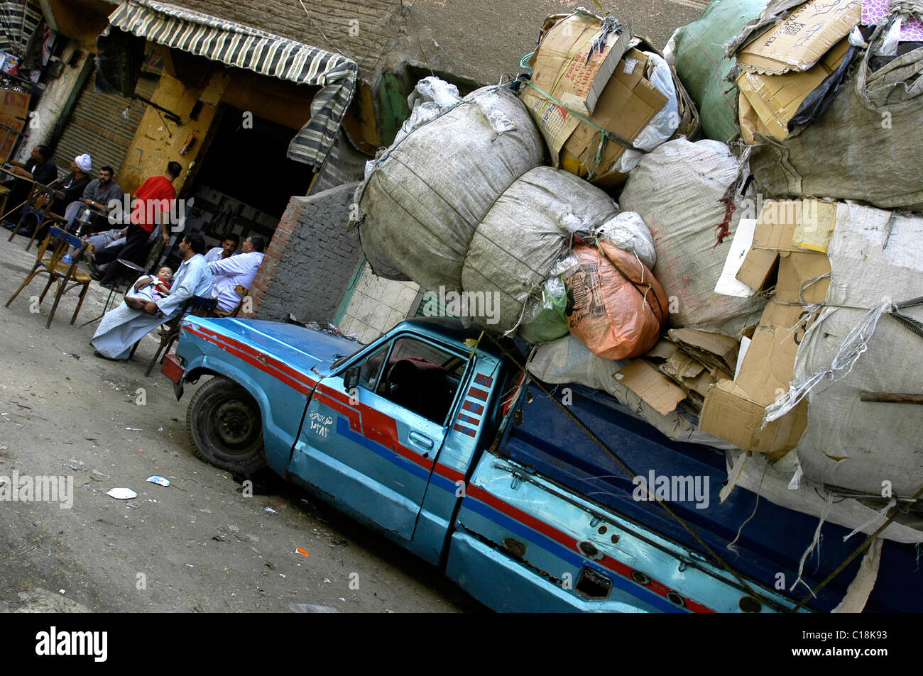 The garbage collectors go from house to house to collect all garbage ...