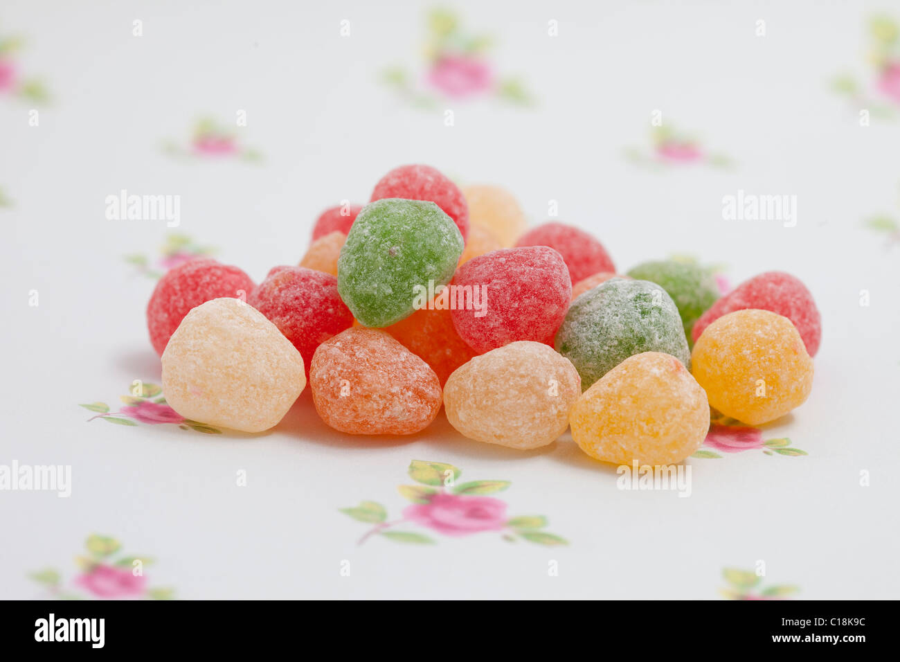 pear drops, small, sweets and candy on a paper background photographed ...