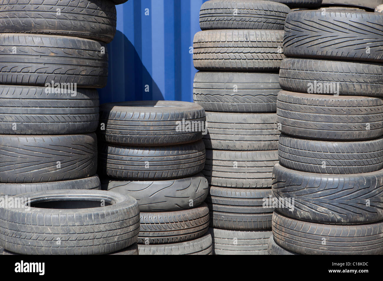 Packs of old, used tires Stock Photo - Alamy