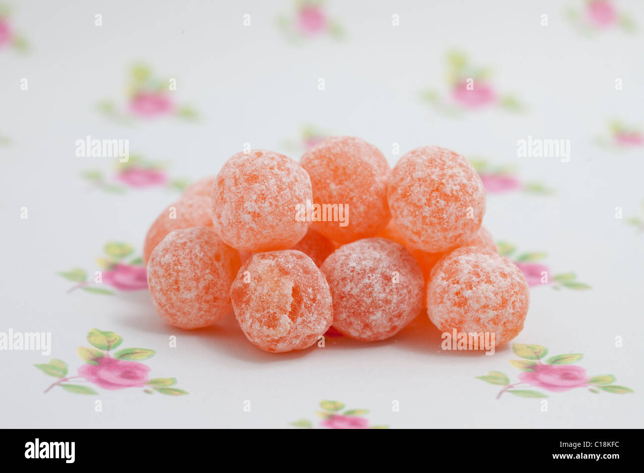 tangerine orange sweets and candy on a paper background photographed in ...