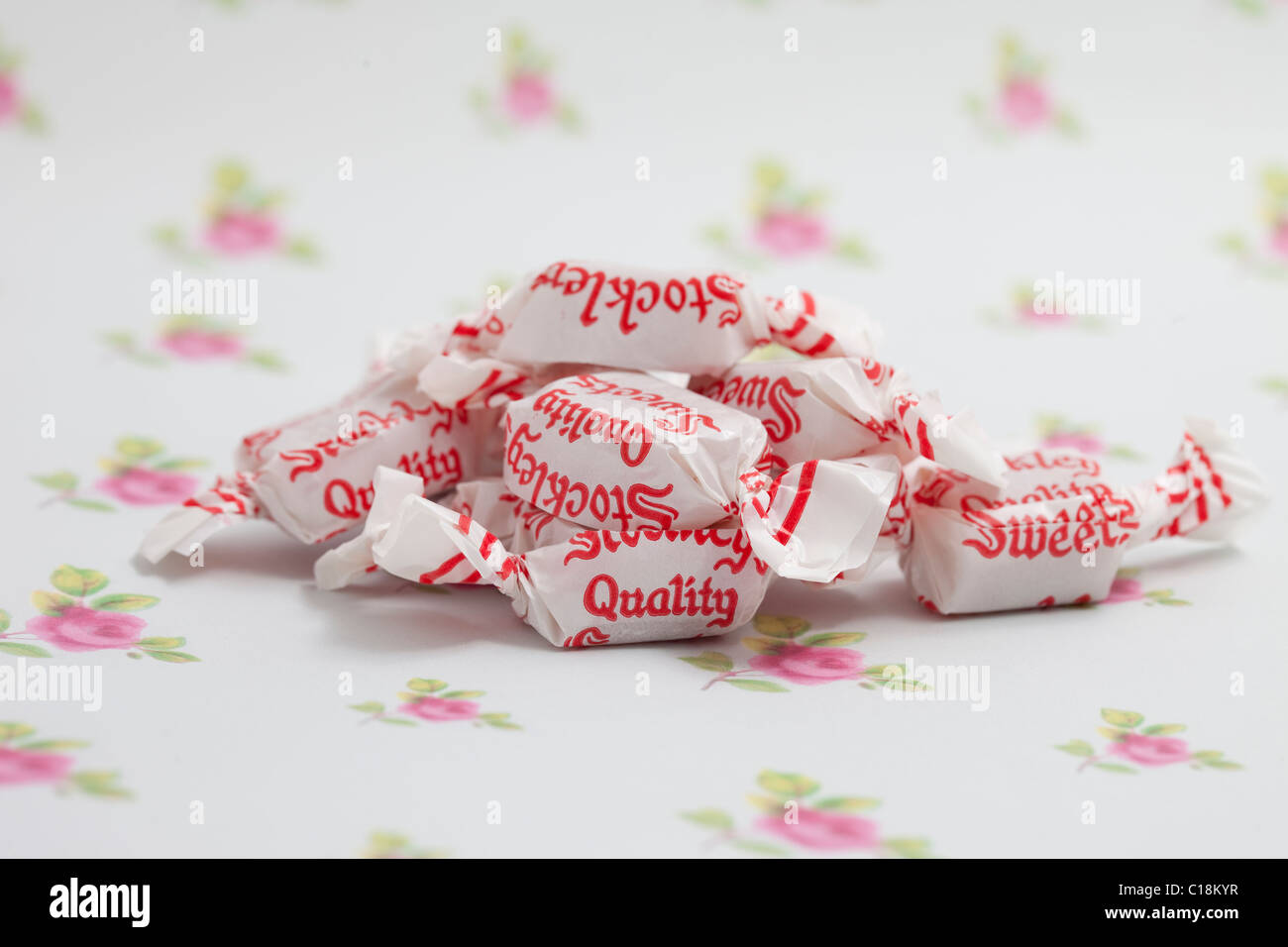 rum and butter toffee sweets and candy on a paper background ...