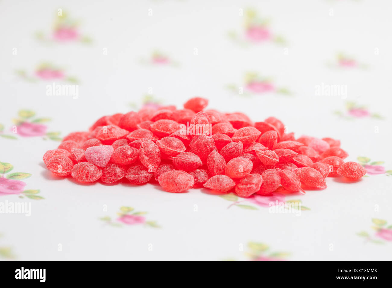 cola pips sweets and candy on a paper background photographed in a ...
