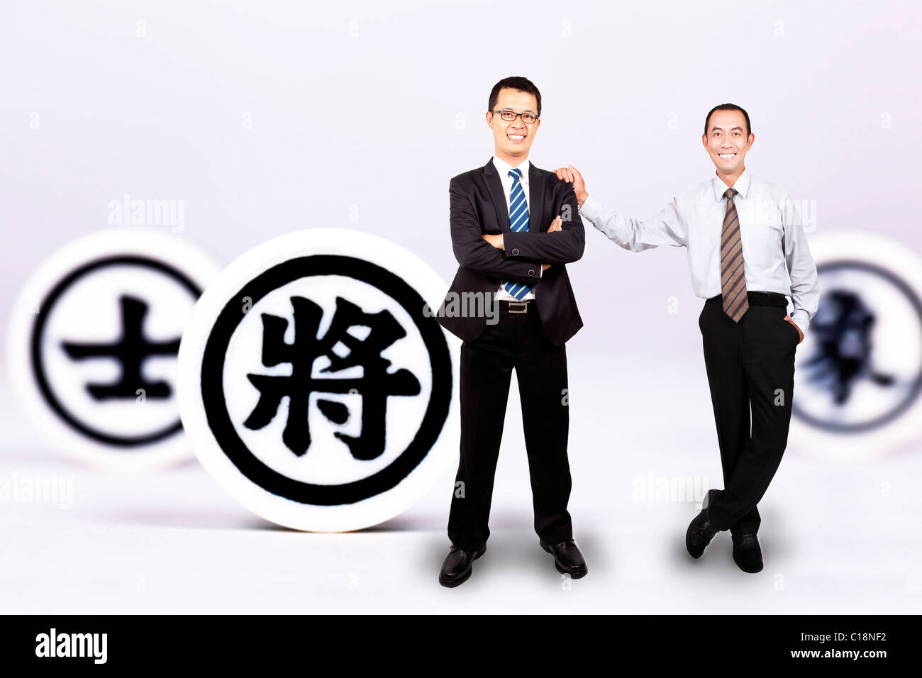 The art of war. two businessman with chinese chess : King,general and ...