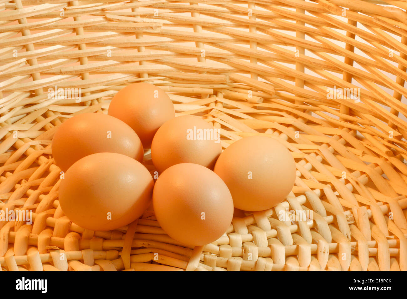 Eggs in a basket Stock Photo - Alamy