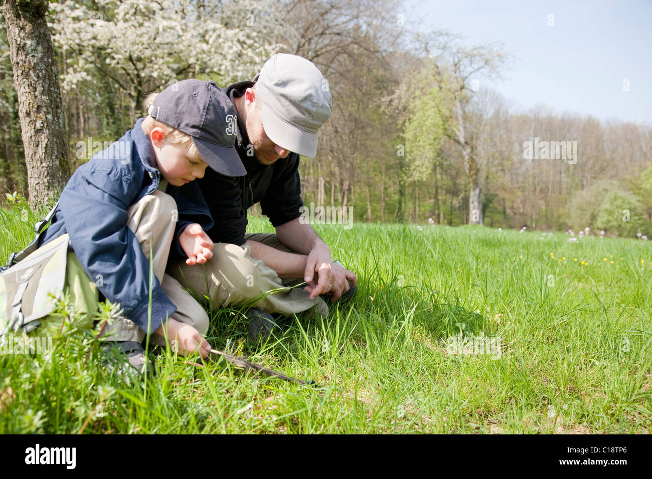Father and son relaxing in nature Stock Photo - Alamy